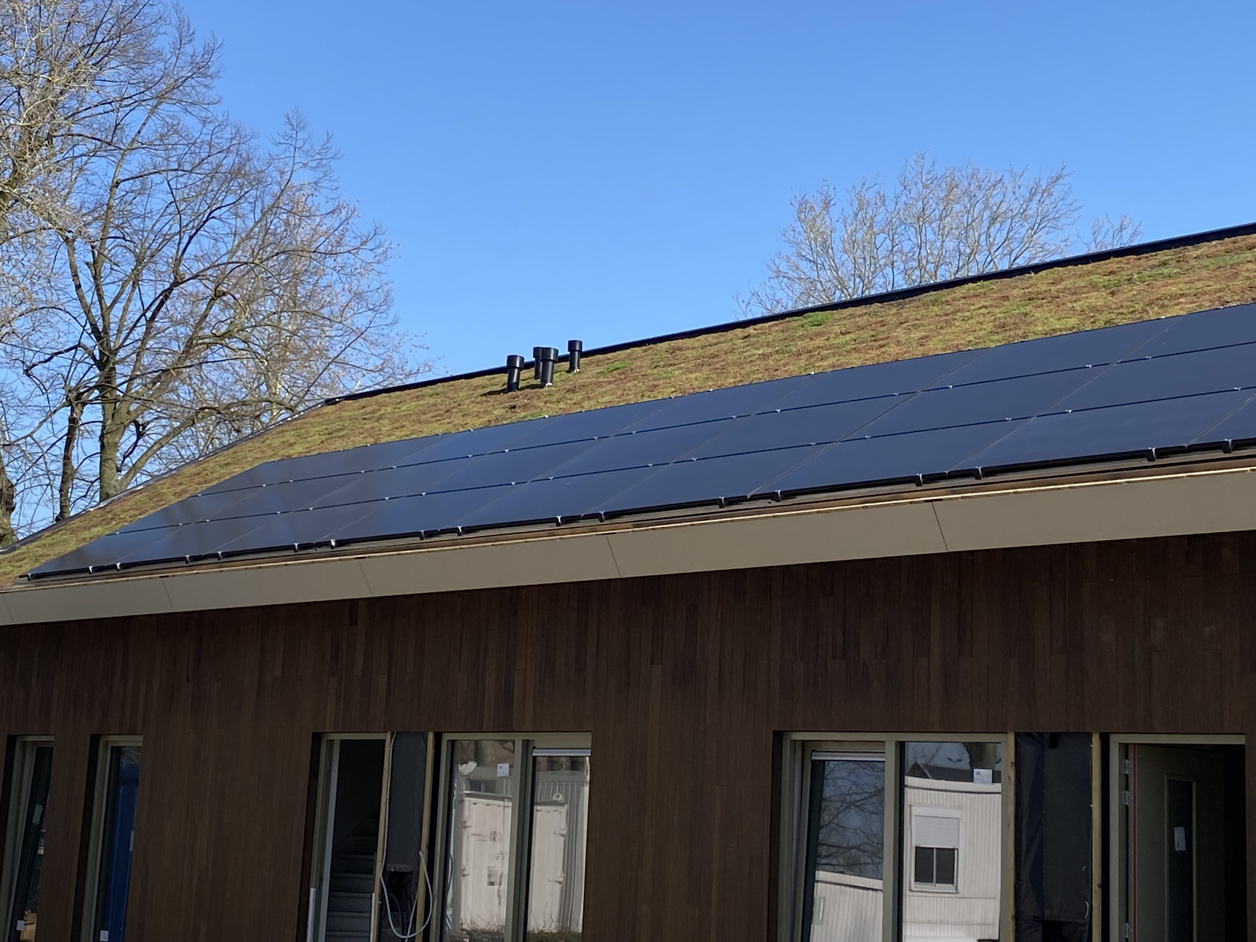 Sempergreen | Unieke ecowijk met hellende groendaken - architectenweb.nl